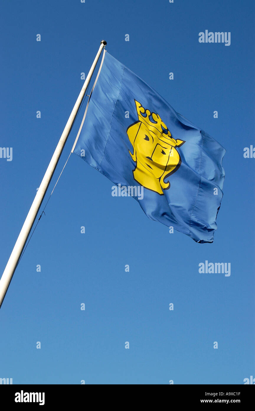 The flag of Saint Erik symbol of Stockholm floating in the wind at City ...