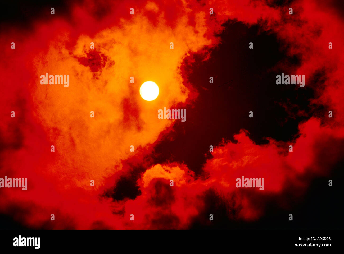 Sun Behind Clouds On Fire Red Sky Stock Photo - Alamy