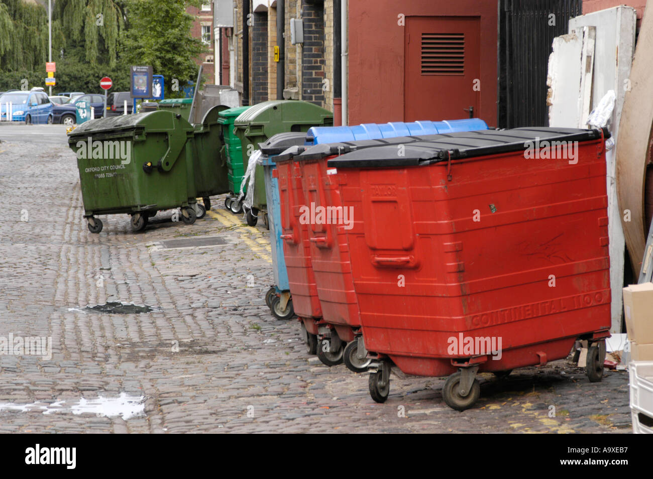 Red and green wheelie bins behind the shops in Oxford city centre Stock ...