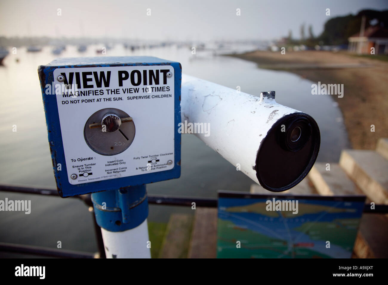Public viewpoint telescope looking towards boats Stock Photo - Alamy
