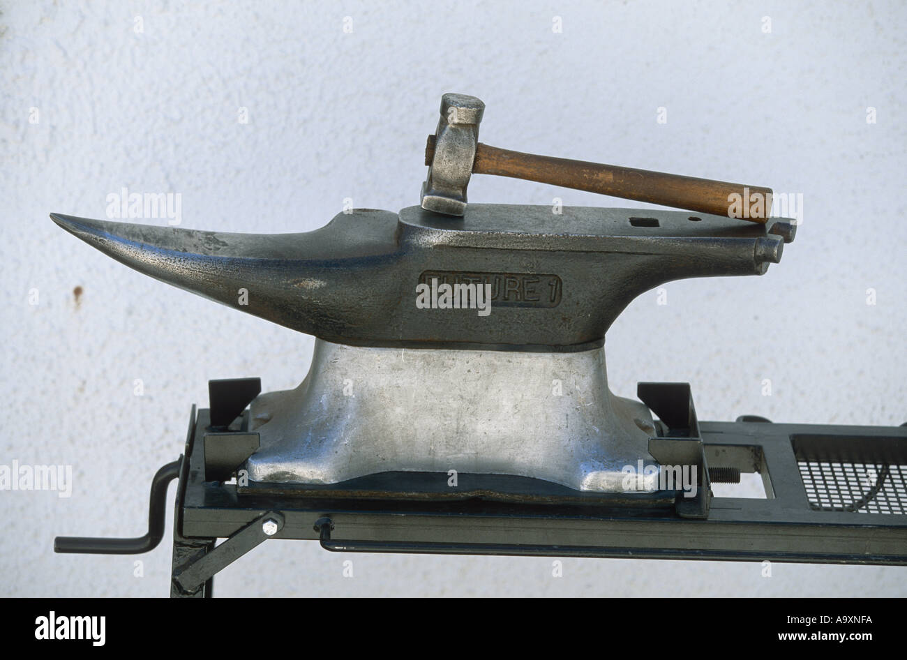 anvil and hammer of a blacksmith Stock Photo - Alamy