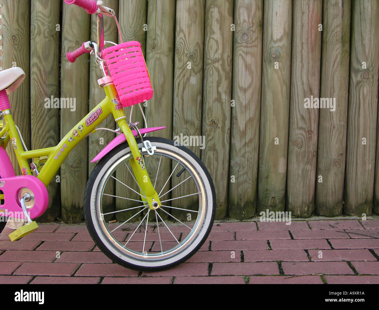 Lime green and pink bike for children Stock Photo - Alamy