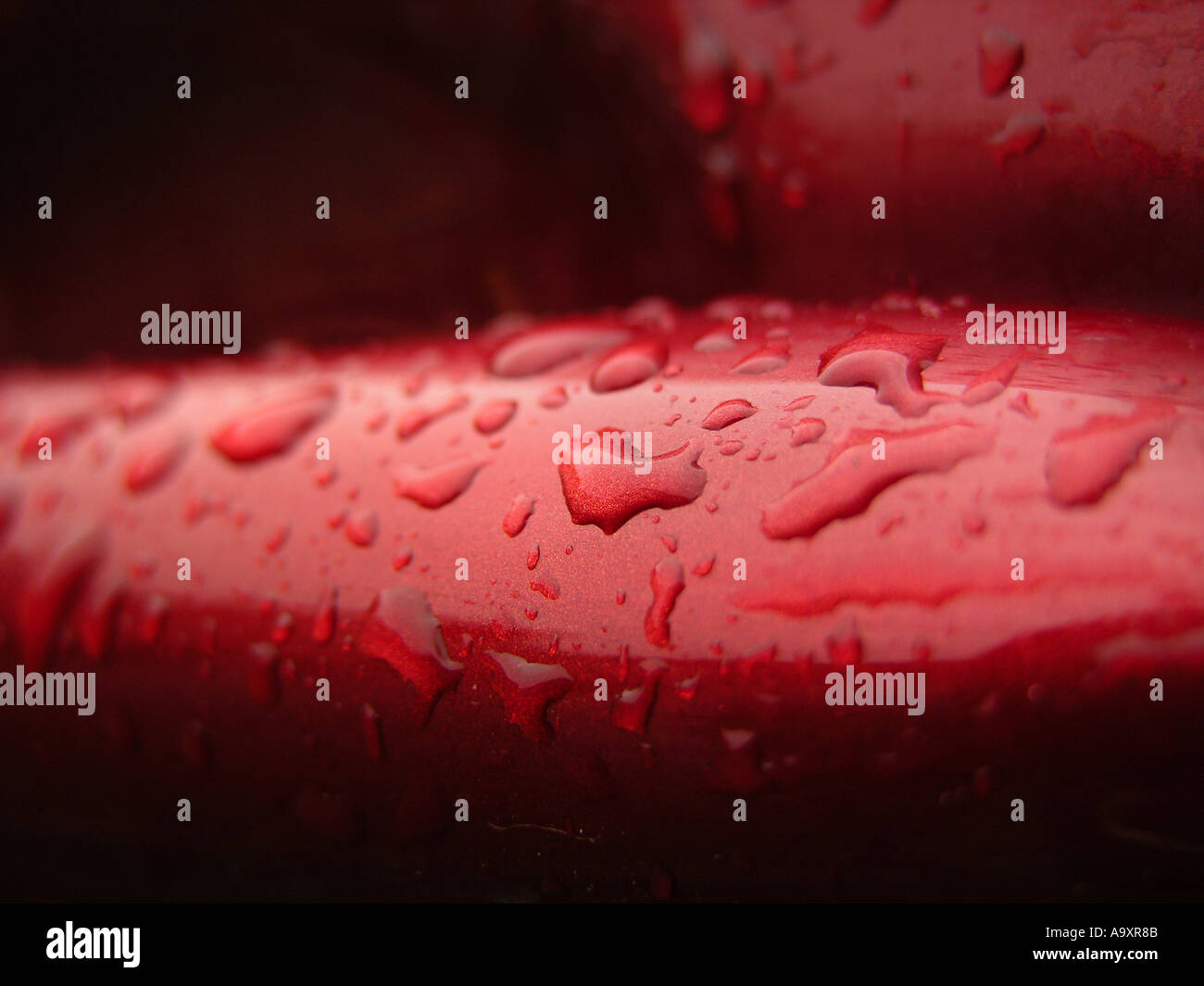 Rain Droplets on a Red Metal Surface Stock Photo - Alamy