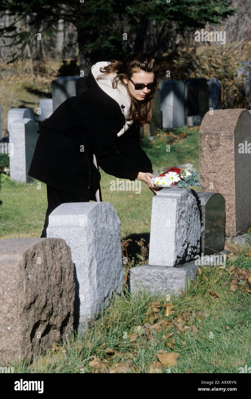 Woman visiting cemetery hi-res stock photography and images - Alamy