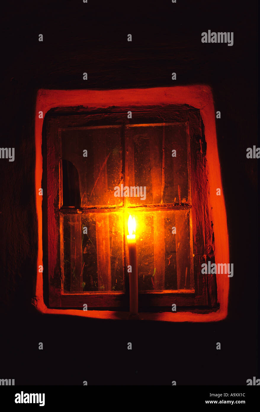 Candle in window of traditional hut Lesotho Africa Stock Photo - Alamy