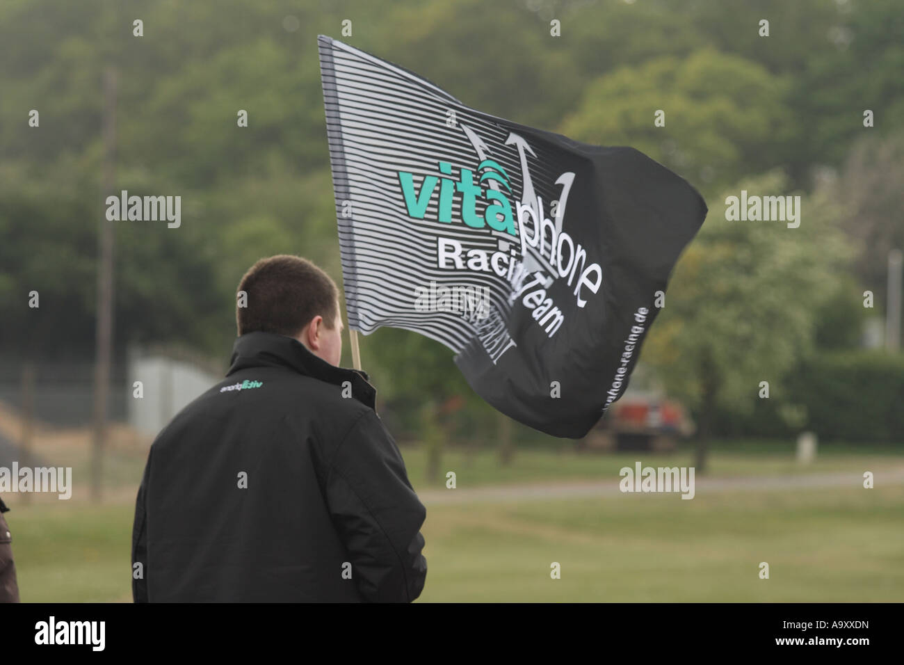 Racing driver man flag hi-res stock photography and images - Alamy