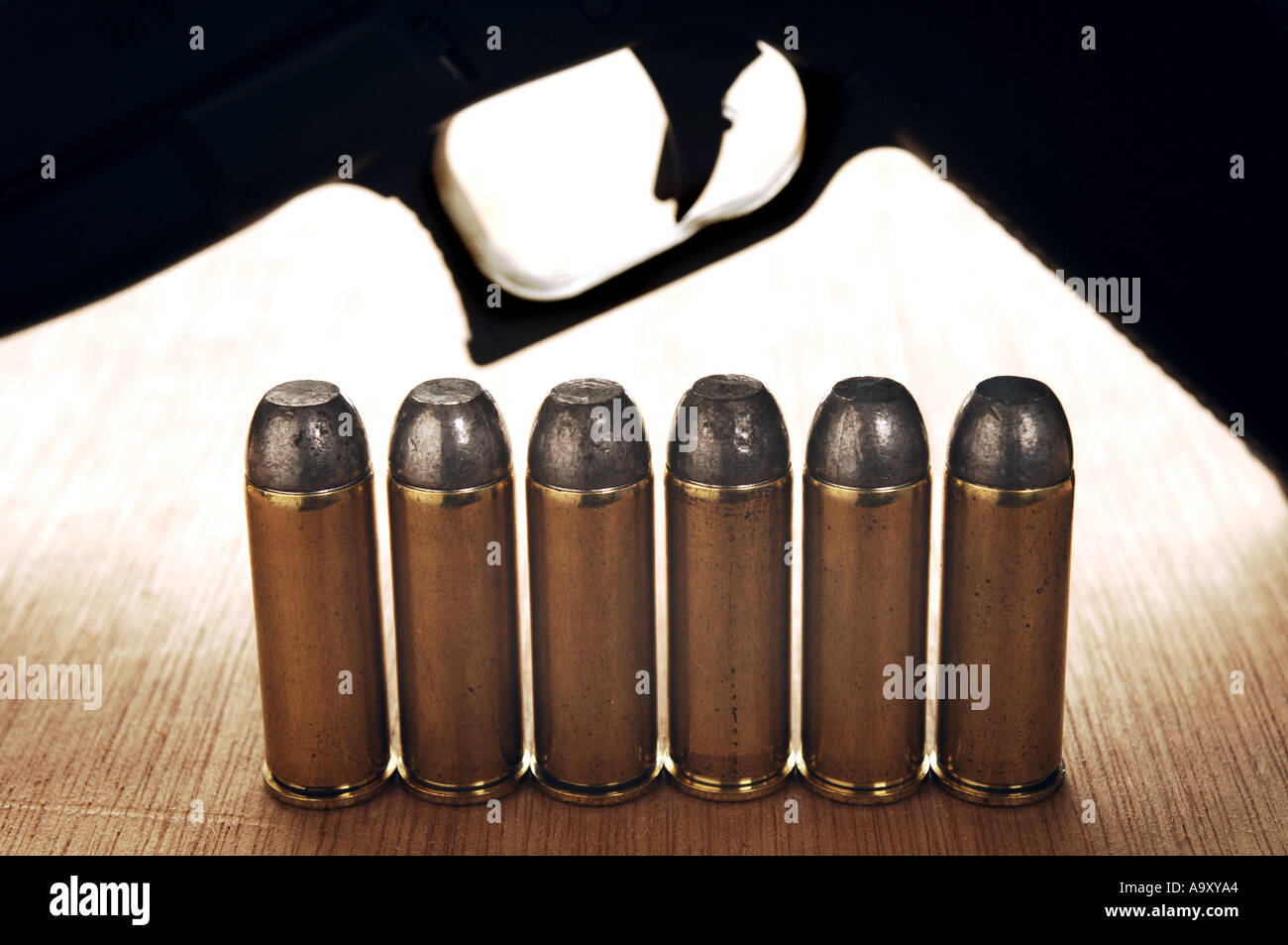 a row of bullets ammunition with a gun trigger Stock Photo - Alamy