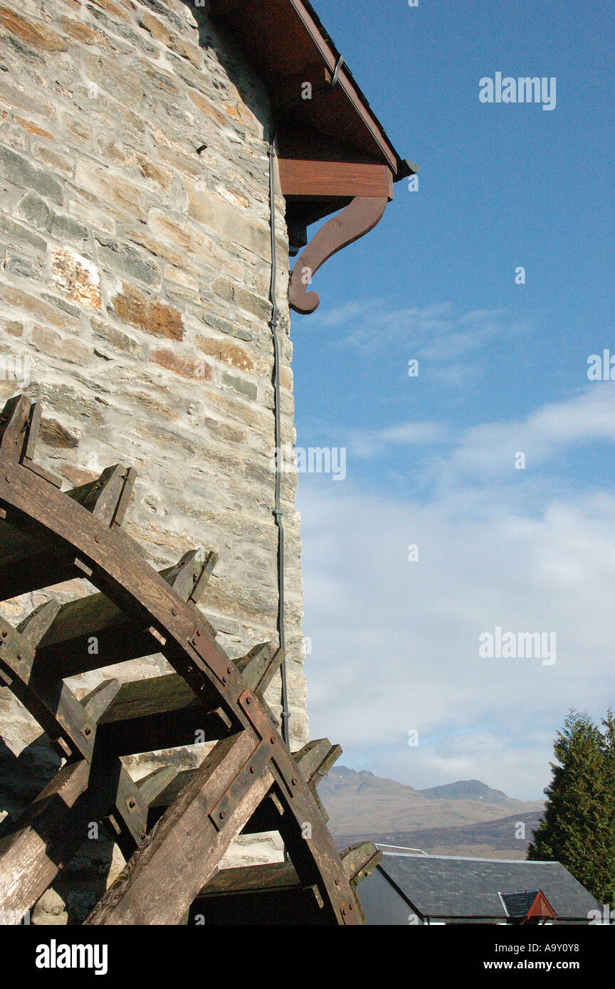The gables of the visitors centre and the water millwheel at the falls ...