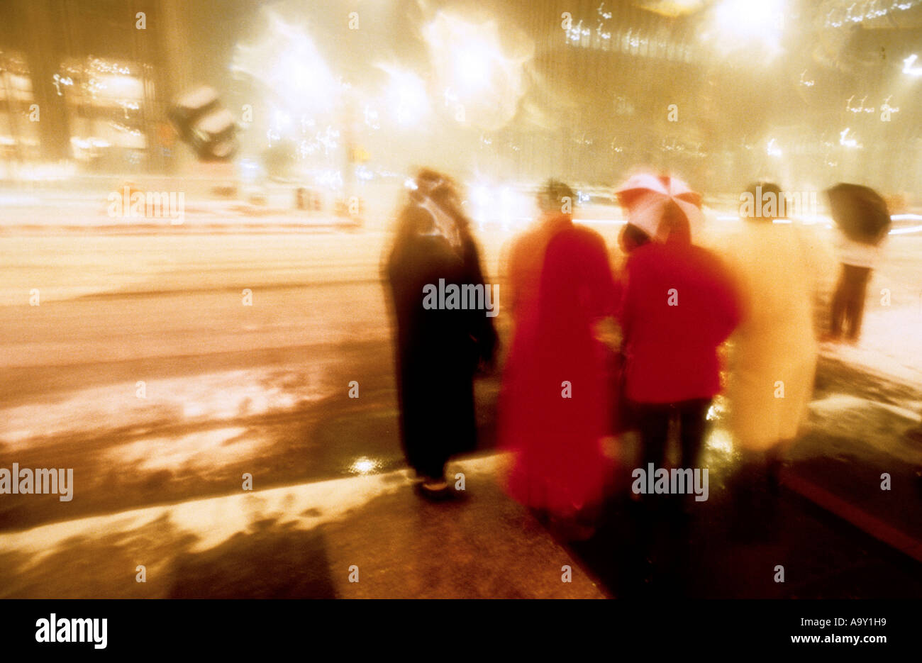 Snow storm in New York City has commuters huddled together Stock Photo ...