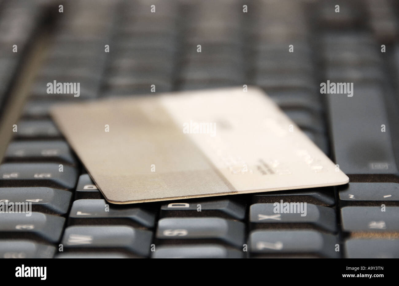 Credit card on top of laptop Stock Photo - Alamy