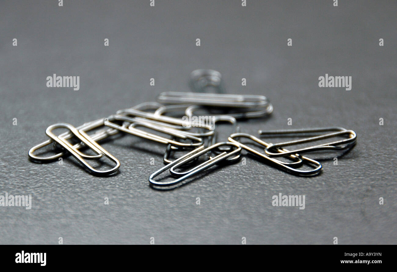 Paper clips on desk Stock Photo - Alamy