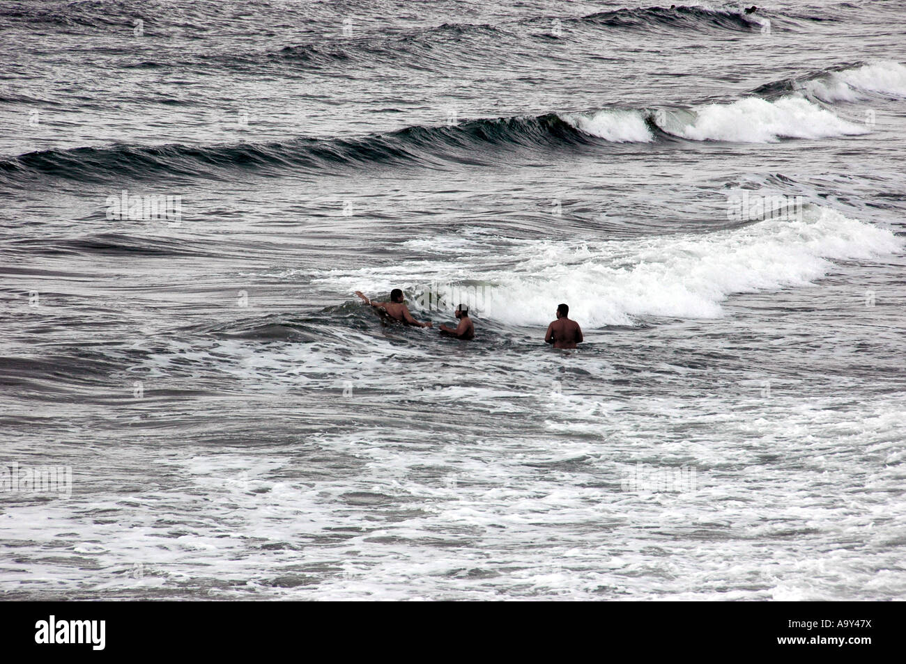 Swimmers in the pacific ocean Stock Photo - Alamy