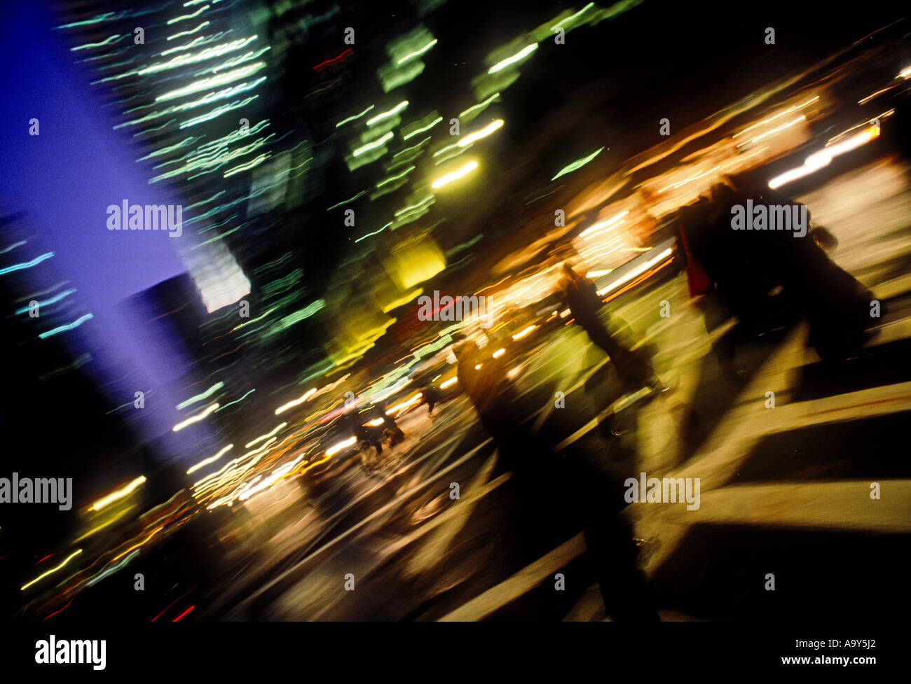 New York commuters cross a busy street at night Stock Photo - Alamy