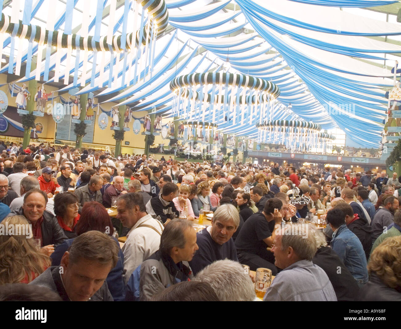 Europe Germany Munich Beer Festival Oktoberfest crowds drinking in Beer ...
