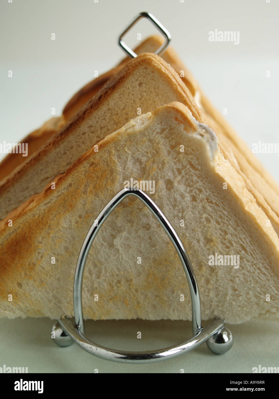 White bread toasted in metal toast rack Stock Photo - Alamy