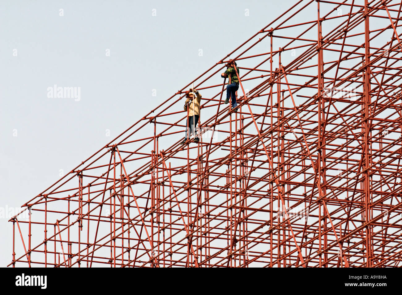 Workers on Scaffolding Stock Photo - Alamy