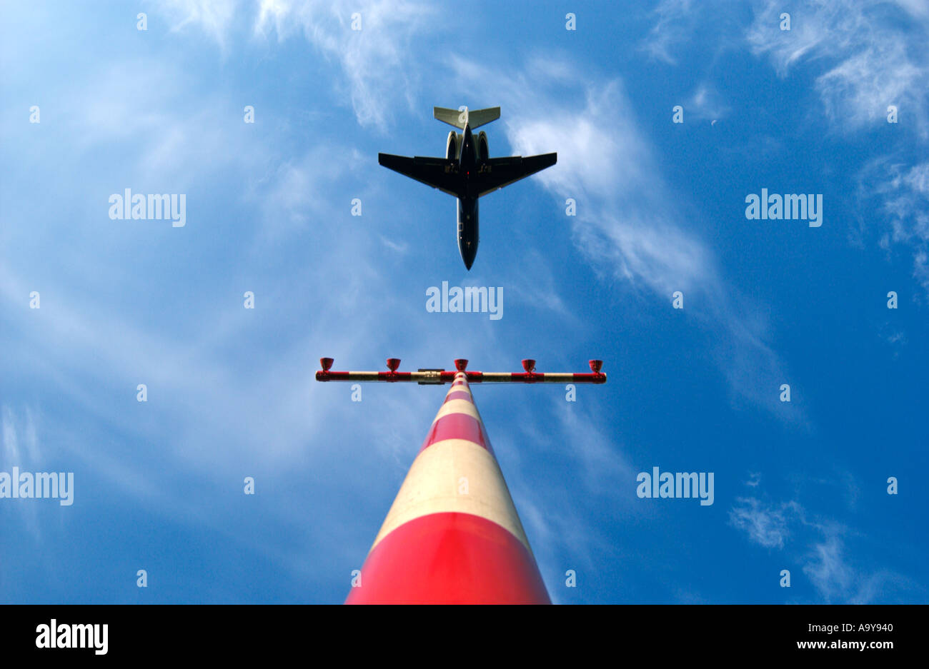 Passenger Plane flying over airport positioning lights Stock Photo - Alamy