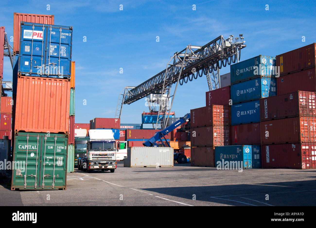 freight containers and truck in container terminal Stock Photo - Alamy