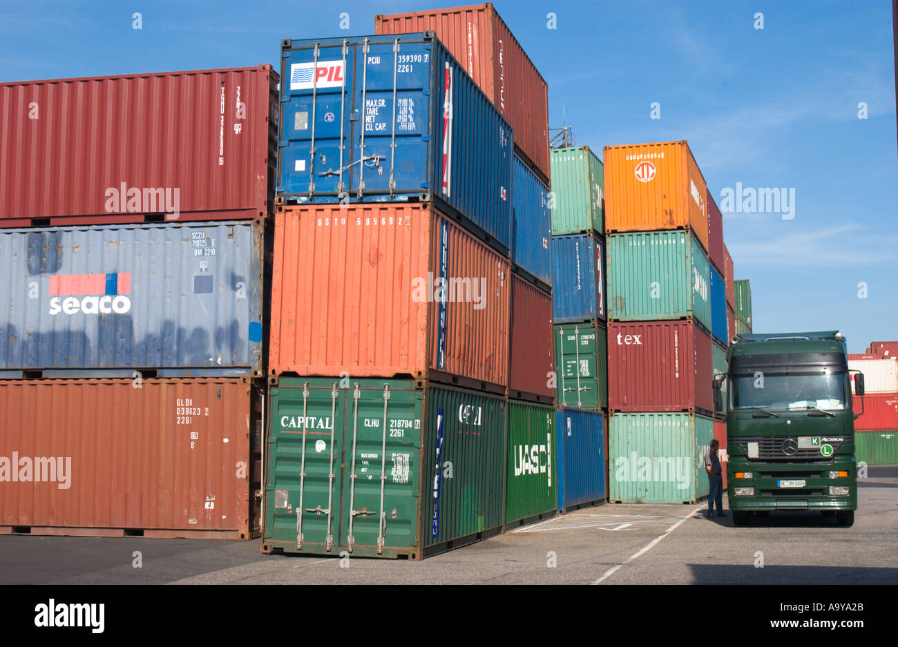 freight containers and truck in container terminal Stock Photo - Alamy