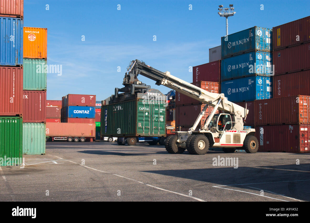 lifter loader moving freight container in container terminal Stock ...