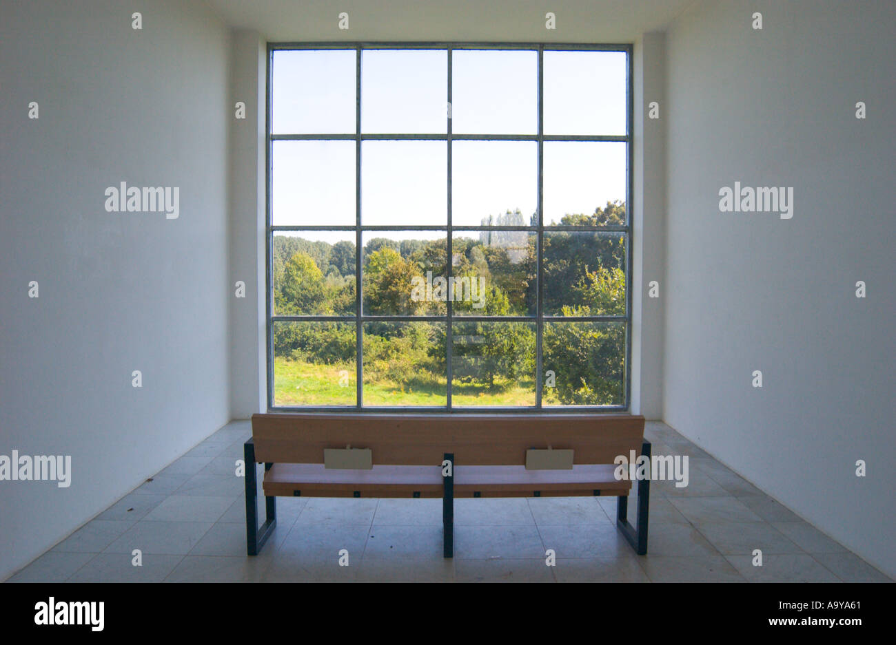 wooden bench in empty room facing large window in Insel Hombroich Art ...