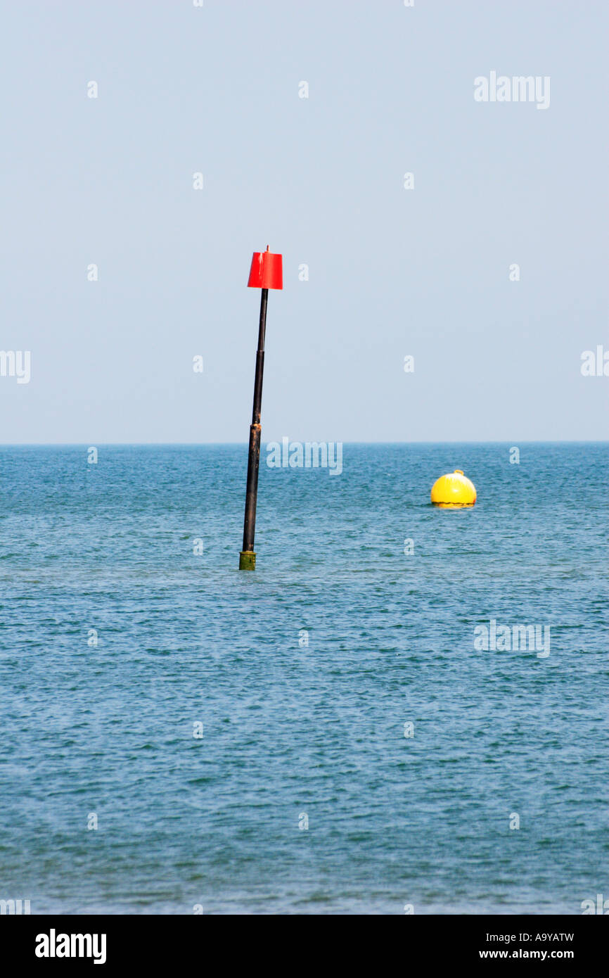 Red sea mark and yellow buoy Stock Photo - Alamy