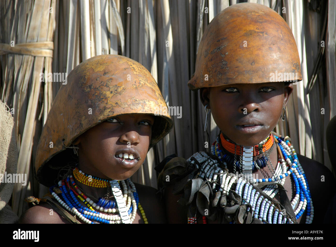 Two young girls of the Arbore people wearing colourful adornment with ...