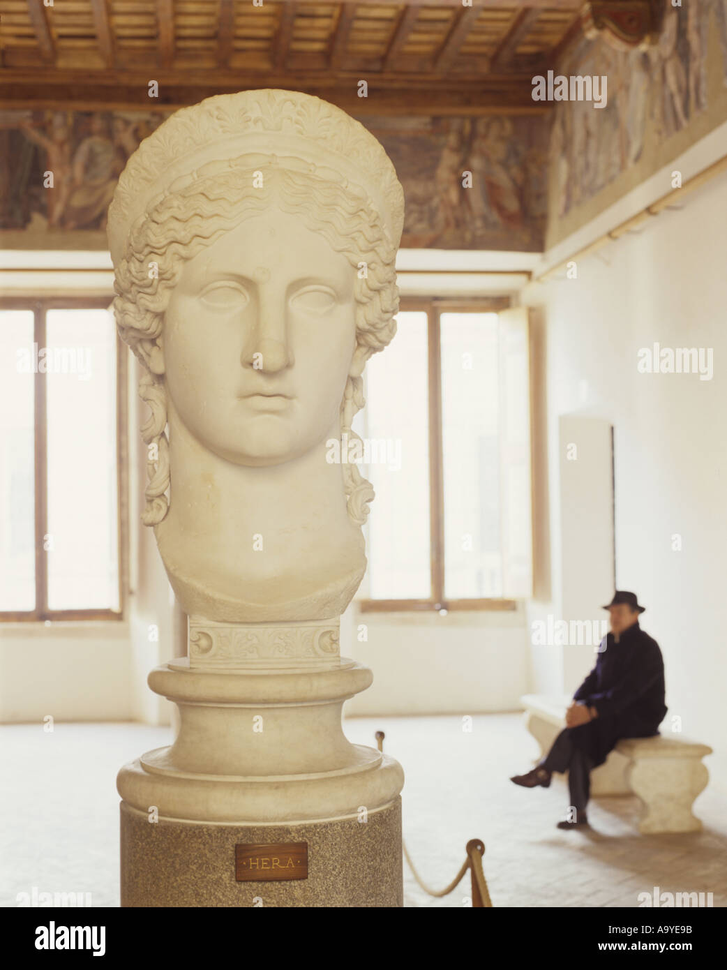 SEATED MAN WITH ROMAN SCUPLTURE Stock Photo - Alamy
