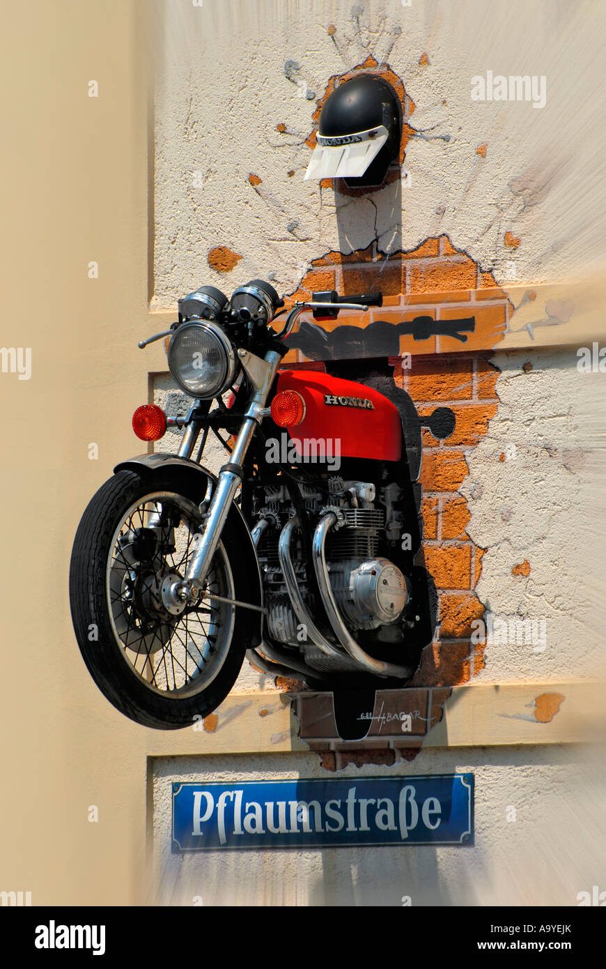 Motocycle stucks in a wall Stock Photo - Alamy