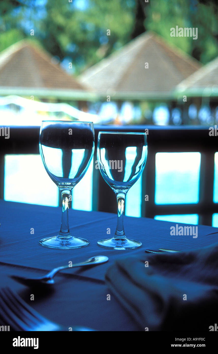 Dining Table with swimming pool behind Stock Photo - Alamy