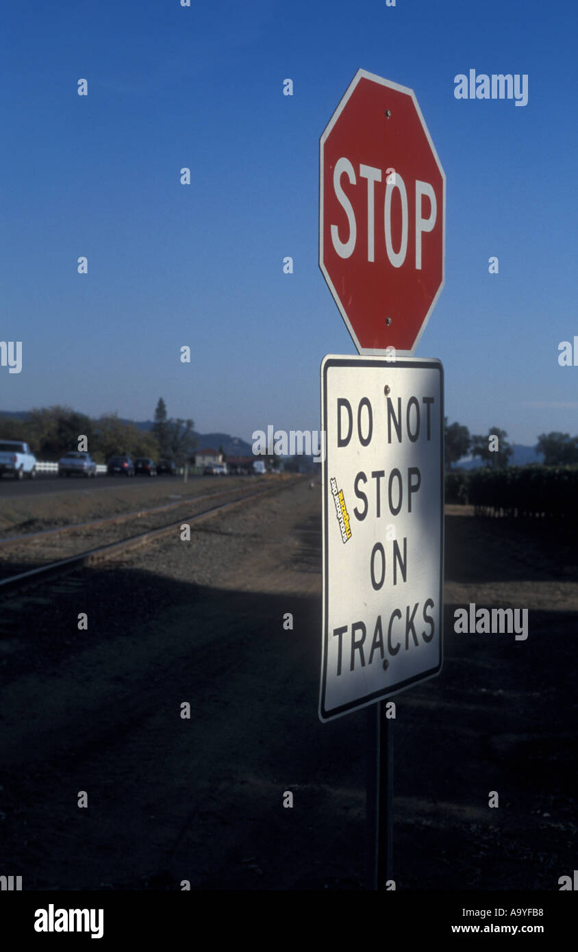 Stop sign near rail track Stock Photo - Alamy