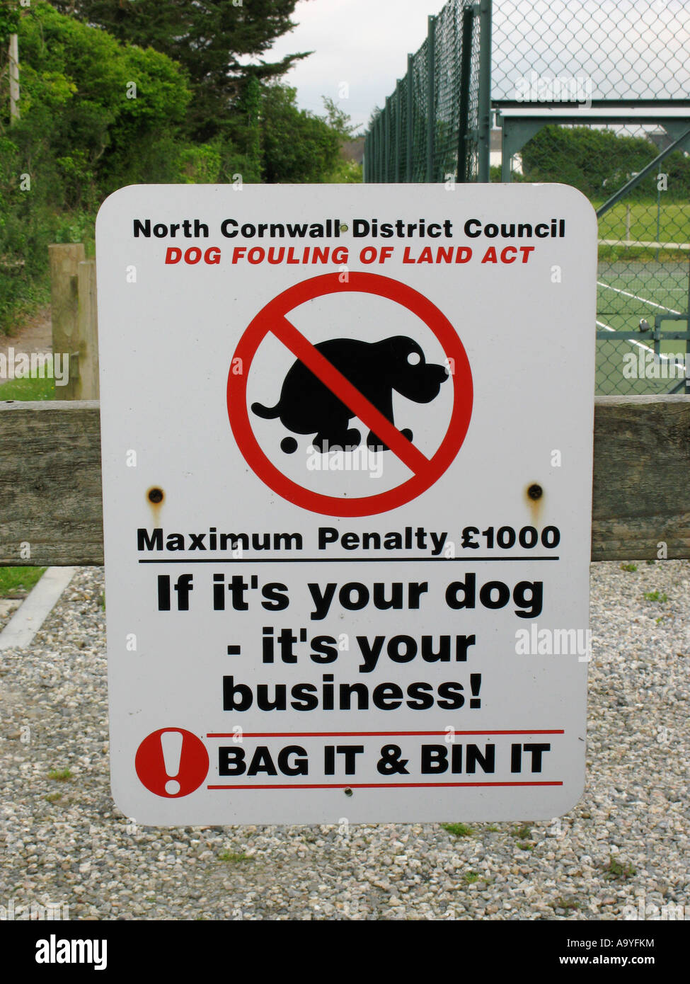 Bin It dog mess sign in Rock Cornwall England UK Stock Photo - Alamy