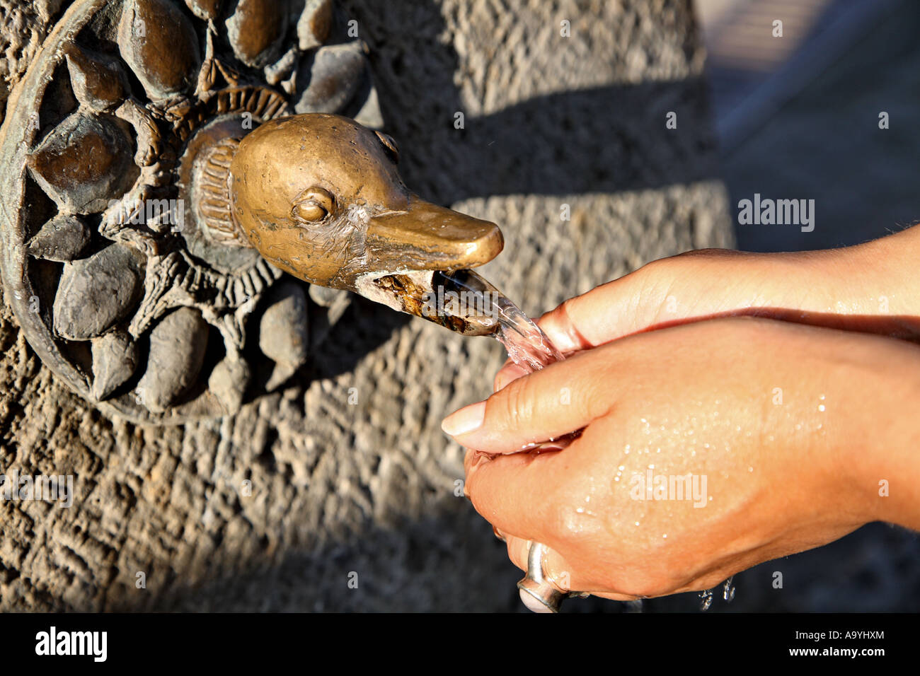 Washing hands in a well Stock Photo - Alamy