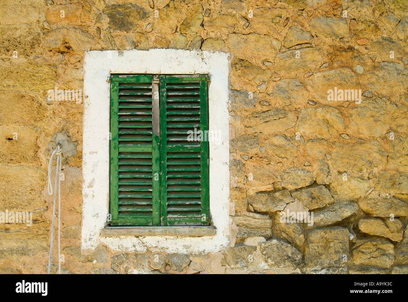 typical Mallorcan green shuttered window on old building Stock Photo ...