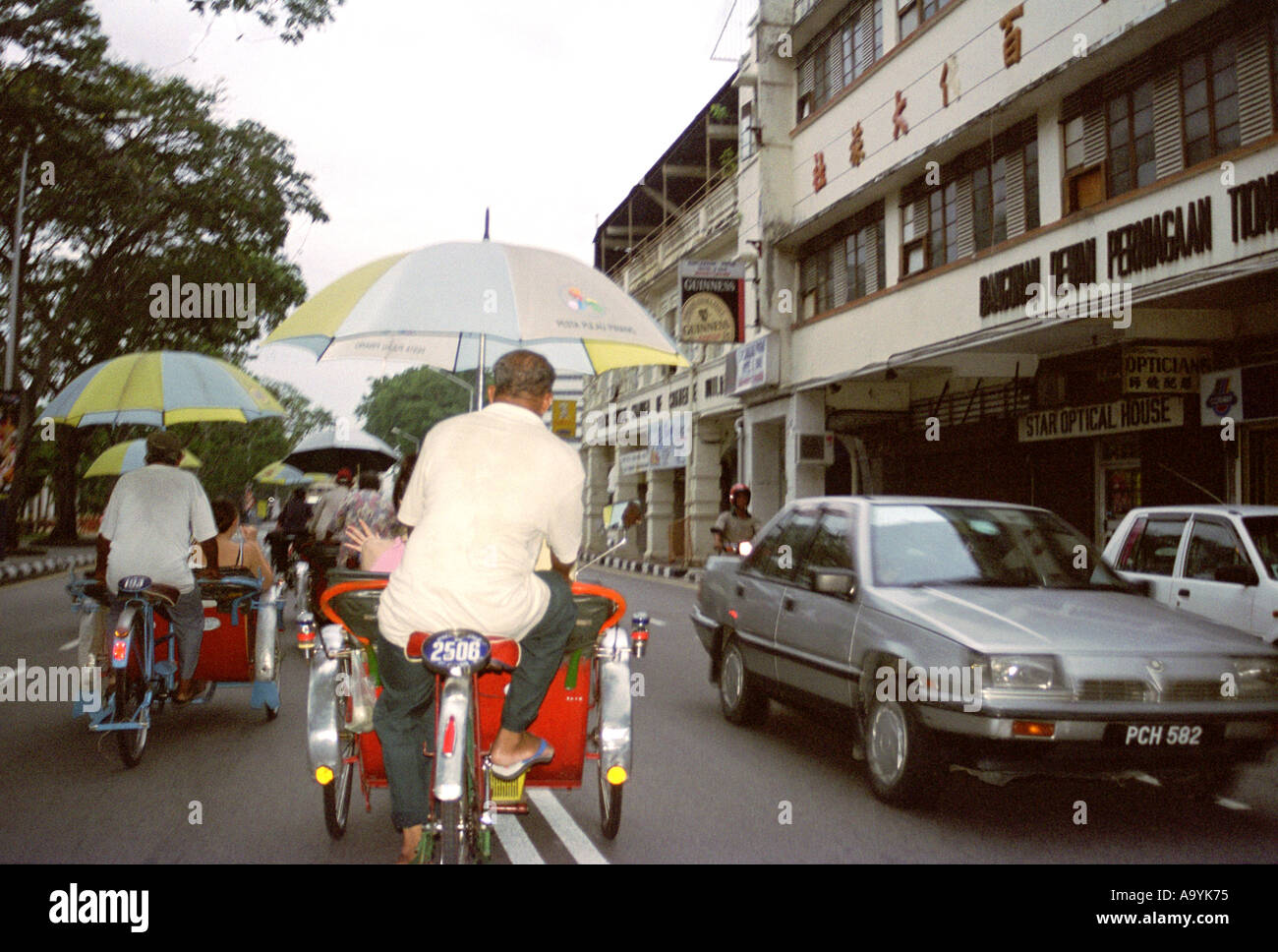 AUSTRALIAN TOURISTS ENJOYING A TRISHAW RIDE GEORGETOWN PENANG MALAYSIA ...