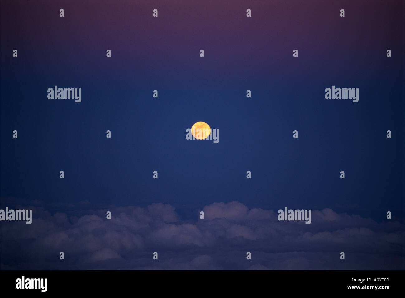 The full moon rising at sunset seen from Mauna Kea Observatory Hawaii ...