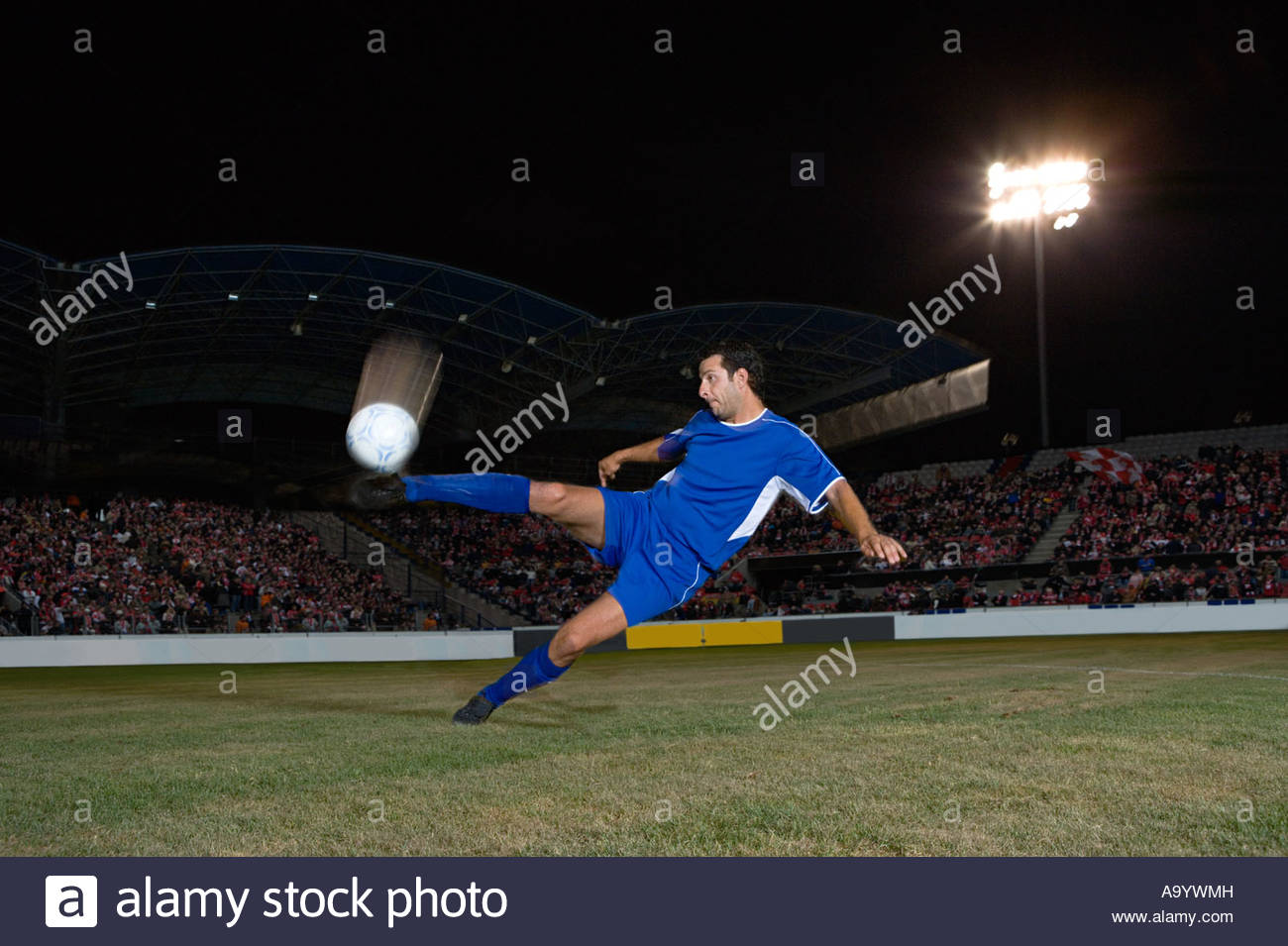 Footballer Kicking Ball Stock Photos & Footballer Kicking Ball Stock ...