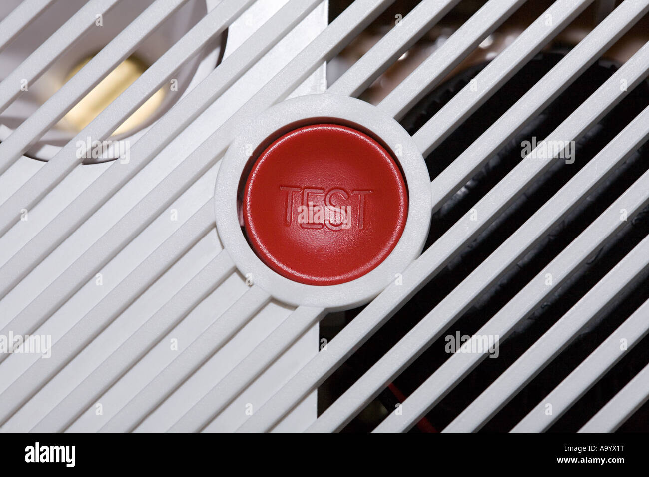 Button on a smoke alarm Stock Photo - Alamy