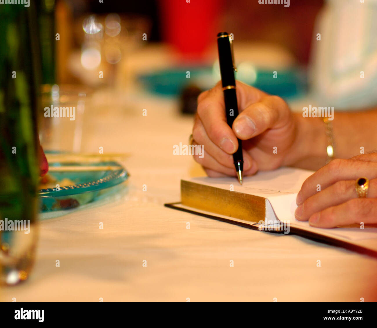 Signing guestbook hi-res stock photography and images - Alamy