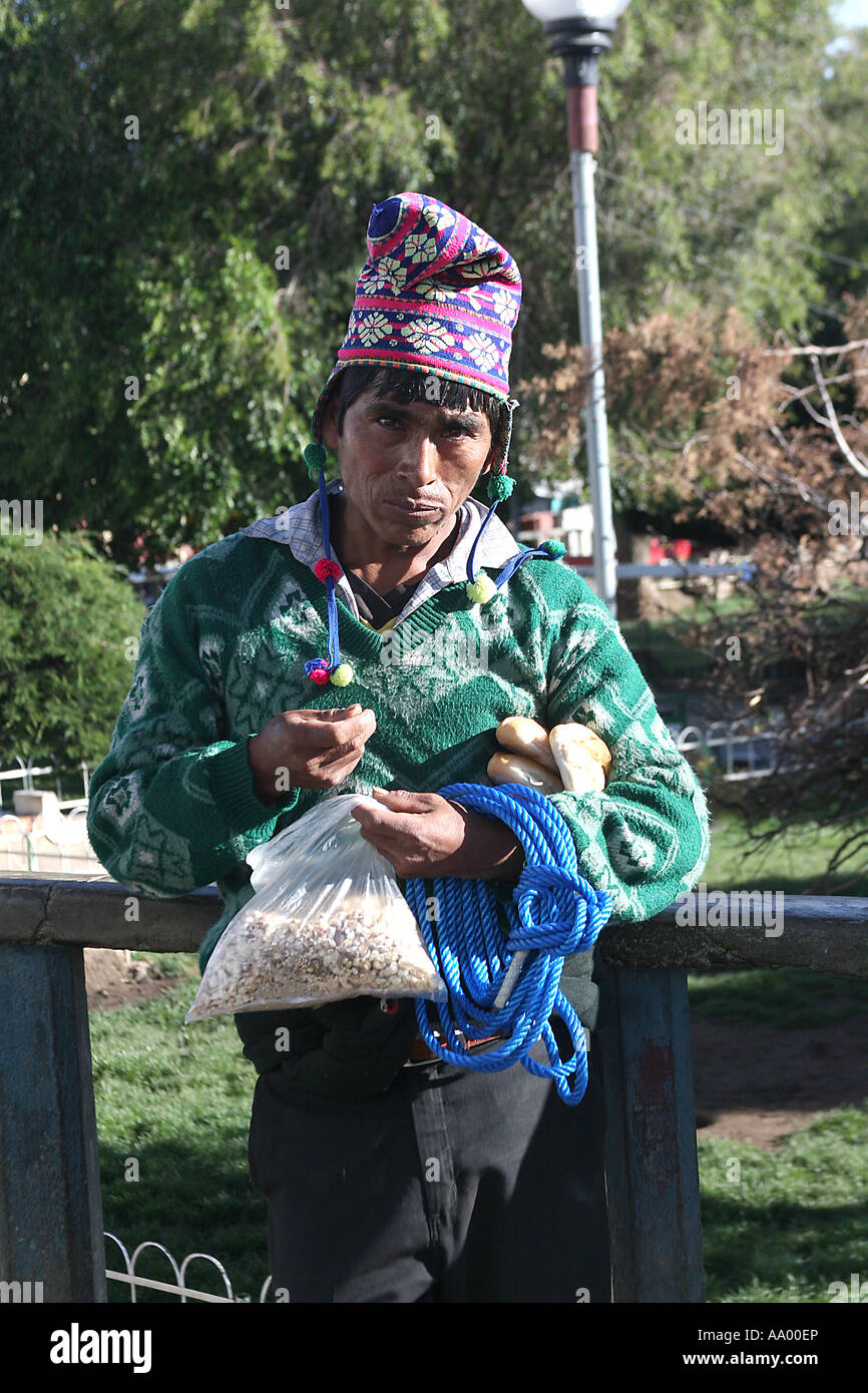 A traditional Bolivian man, campesino, peasant, wearing a colourful ...
