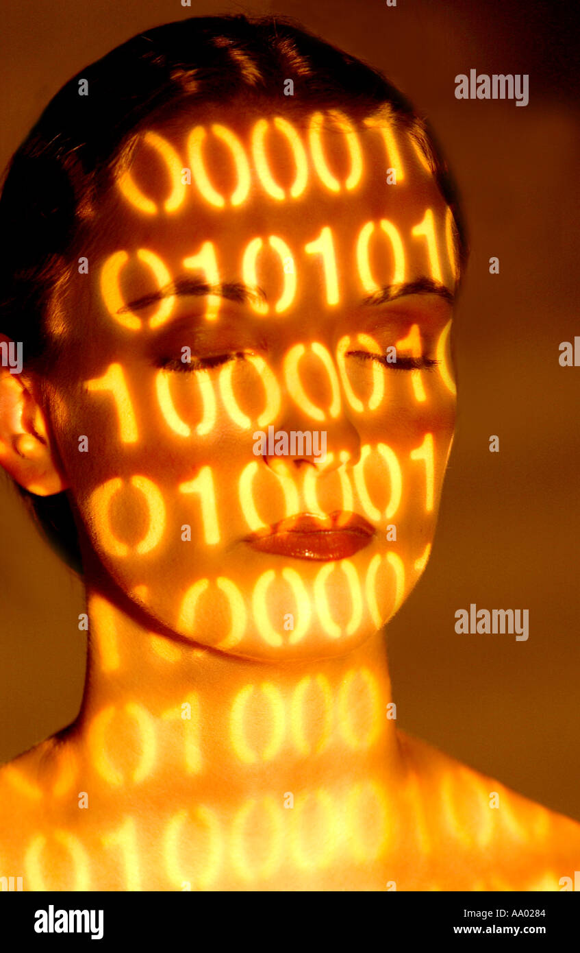 Vertical color image of an adult female with binary code projected onto her face Stock Photo - Alamy