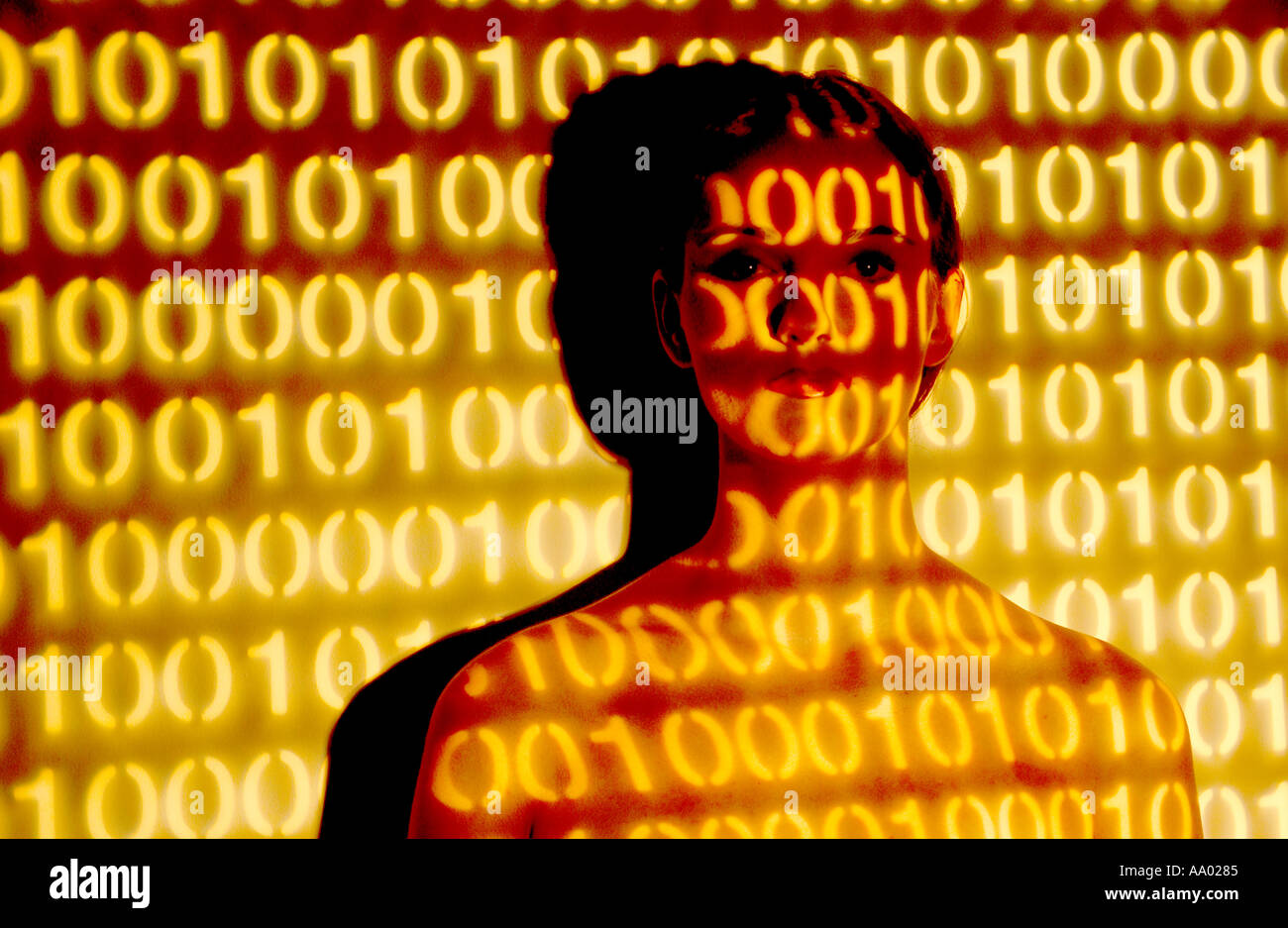 Horizontal color image of an adult female with binary code projected ...