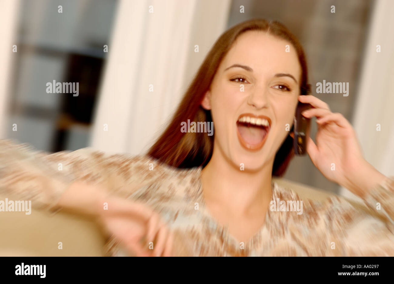 Horizontal color image of an adult female talking on a phone from home ...