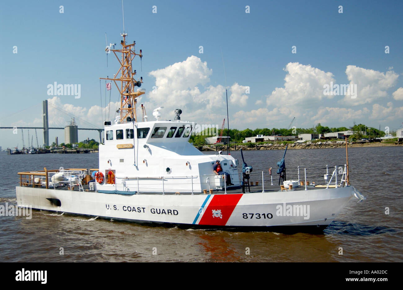 U. S. Coast Guard boat patrolling the waters on a bright day ...