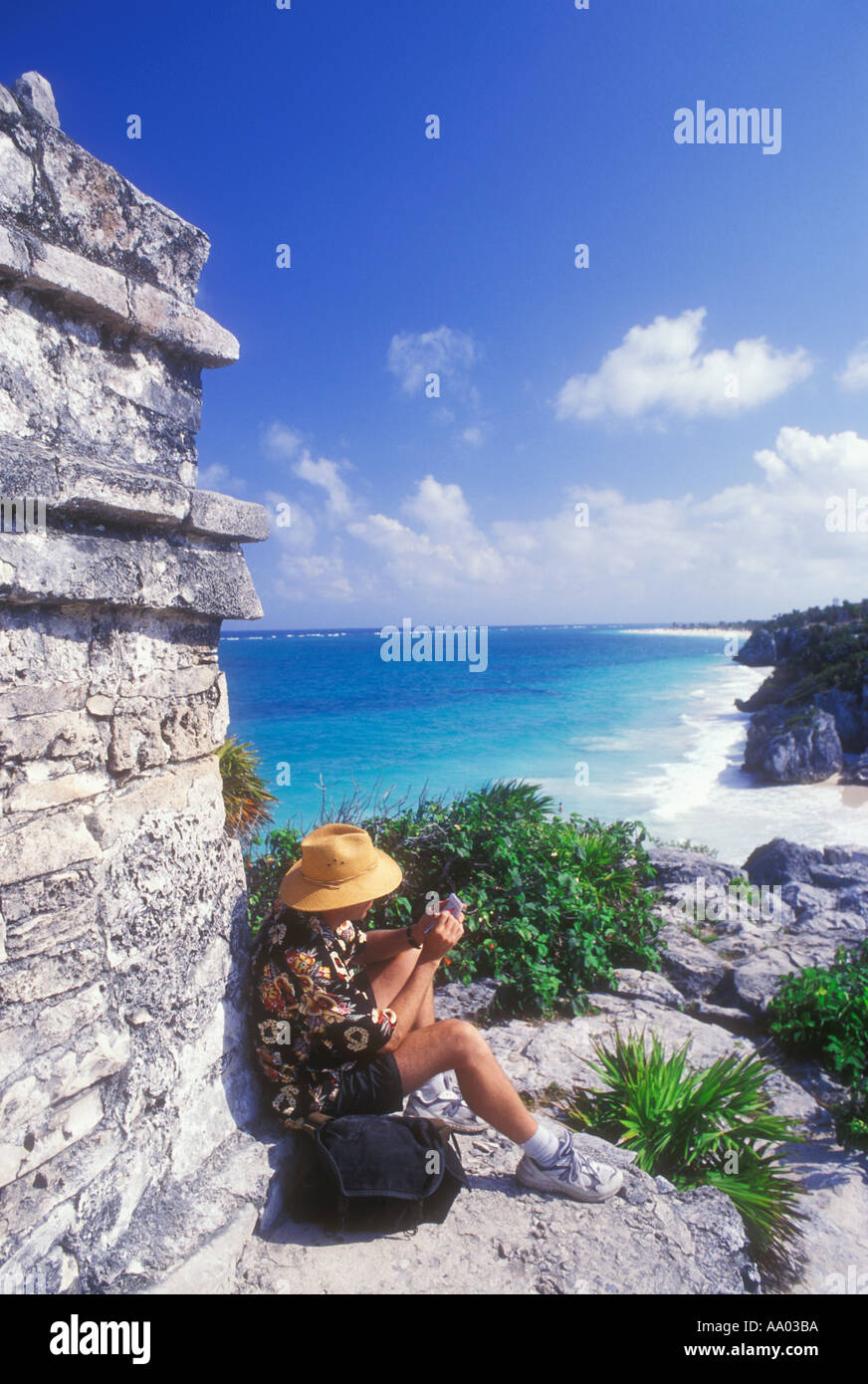 Man sitting next to Mayan ruins at Tulum Quintana Roo Mexico Model ...