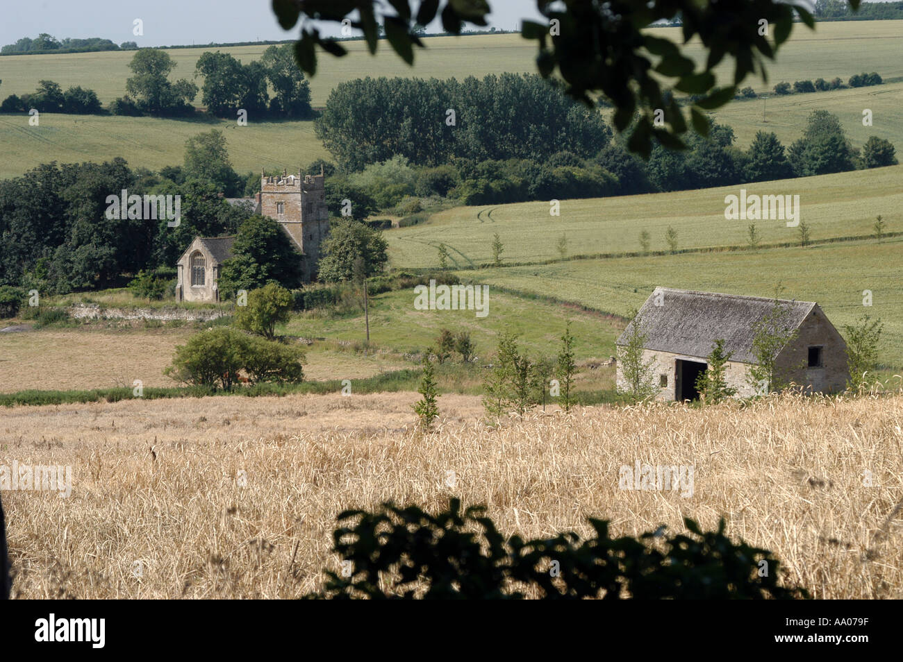 Little Rollright church and barn in the Valley Stock Photo - Alamy
