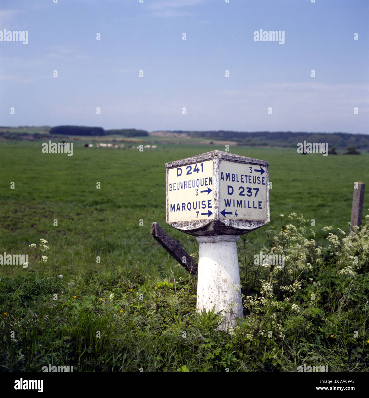 Old fashioned traditional road sign on the junction of the D241 and ...