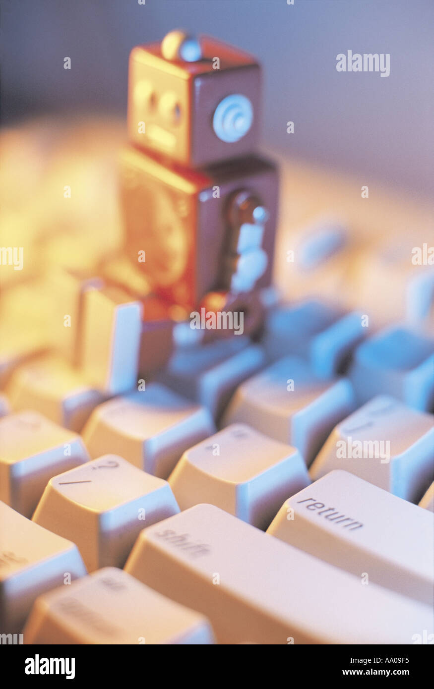 Toy Robot on Computer Keyboard Stock Photo - Alamy