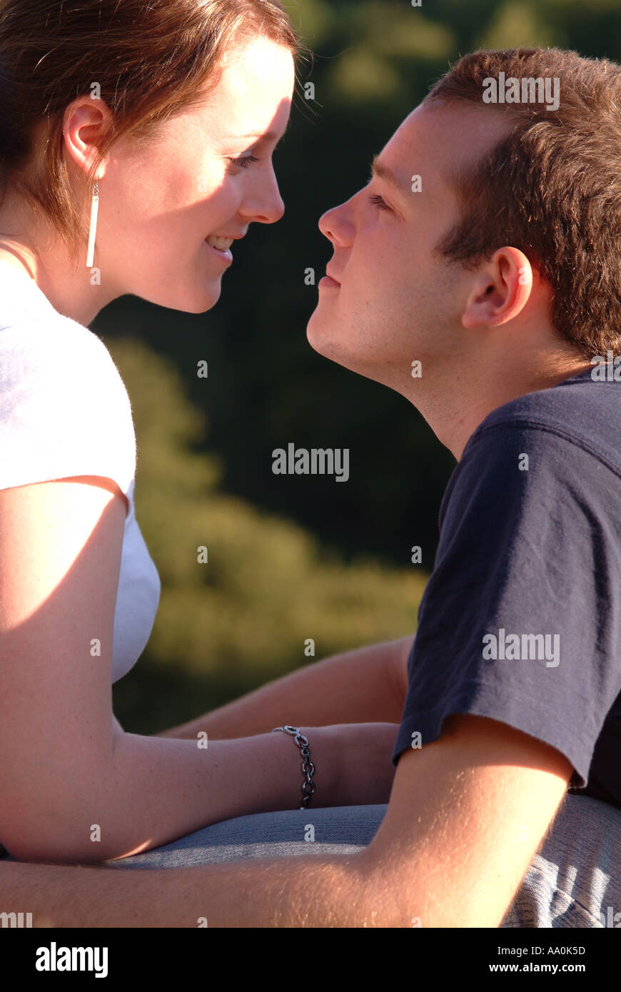 Young happy couple gazing intently into each others eyes Stock Photo ...
