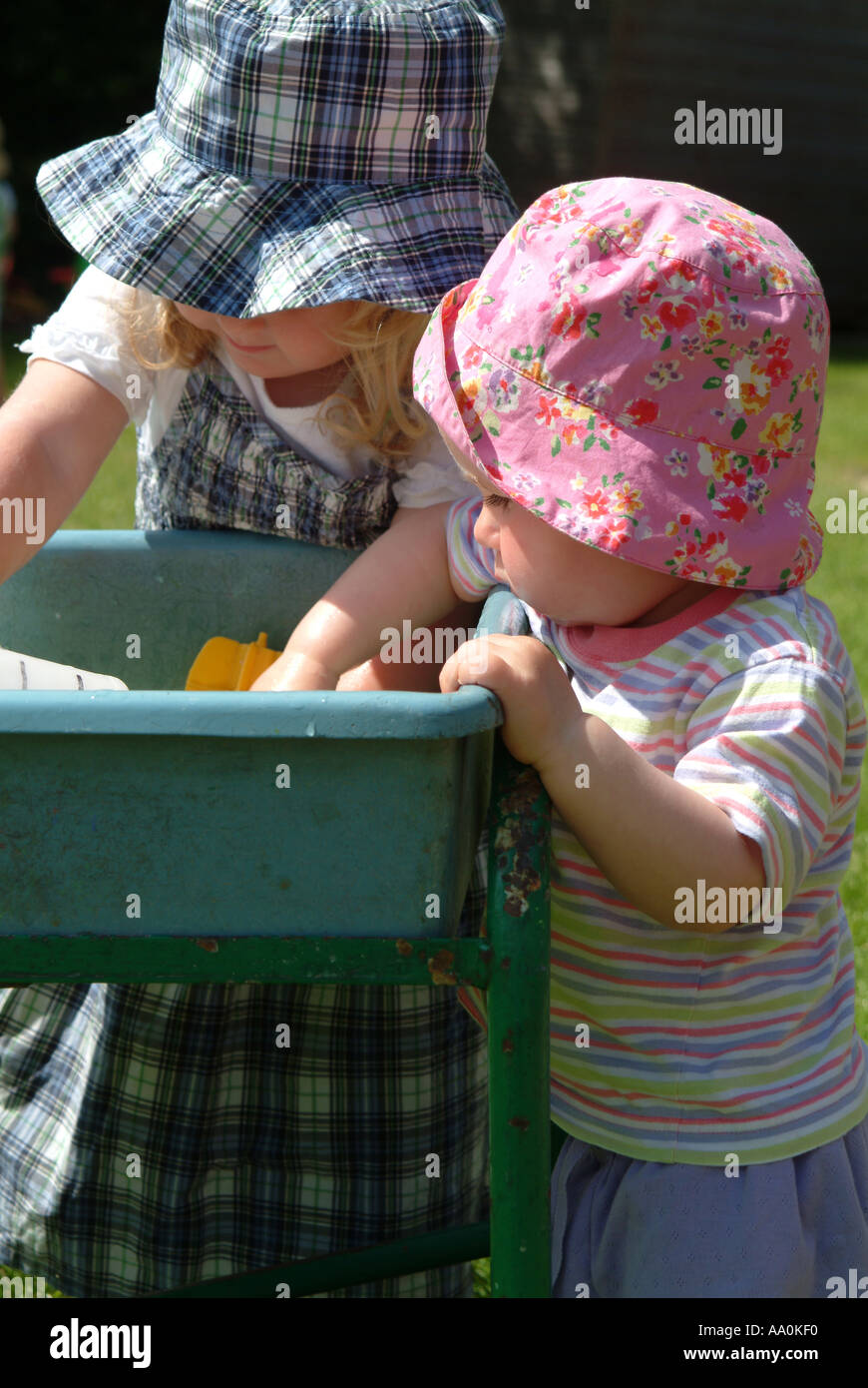 Children playing outside and wearing hats hi-res stock photography and ...